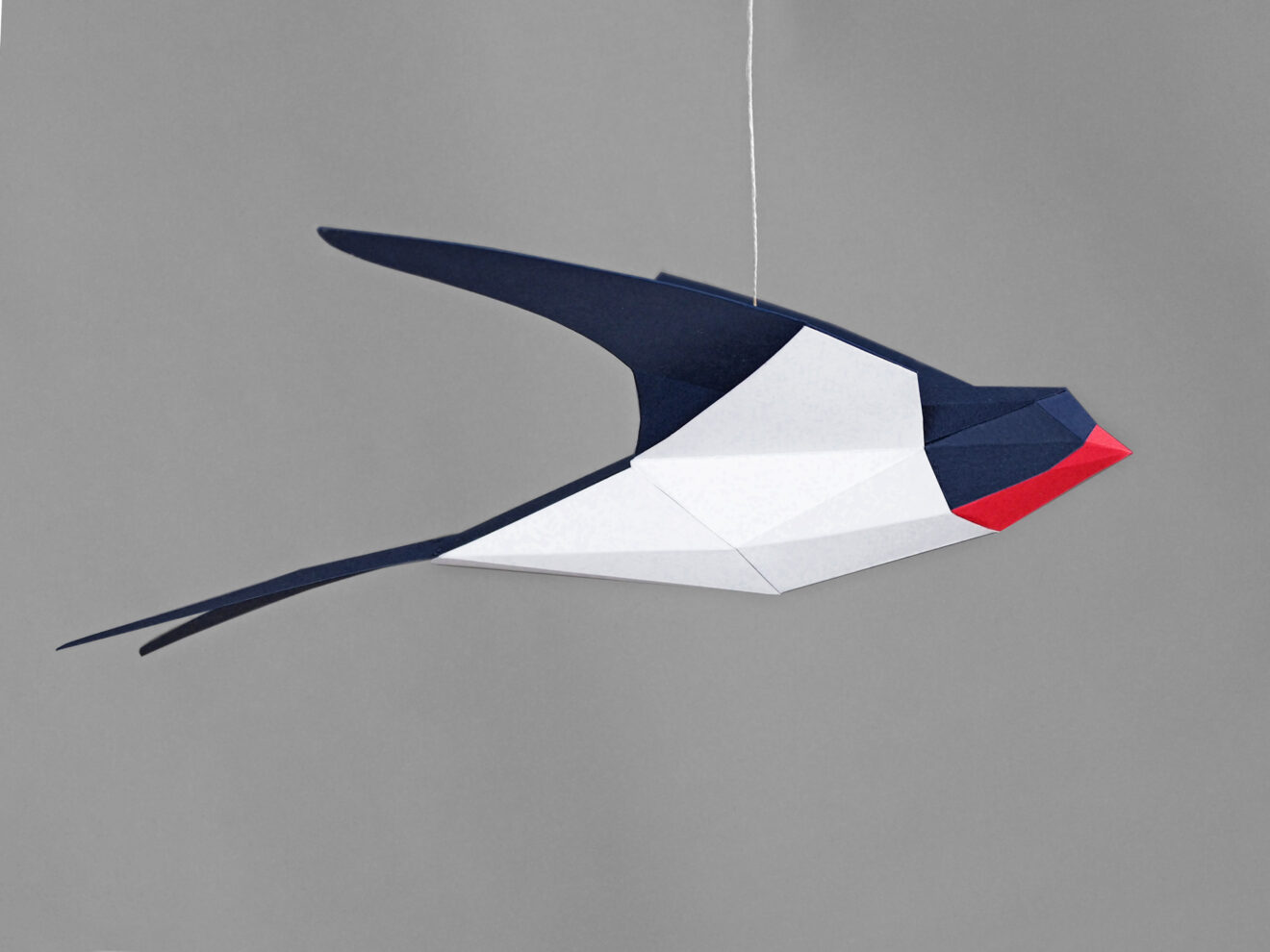 Swallow bird papercraft sculpture. Low poly bird - SmagaPaperwood